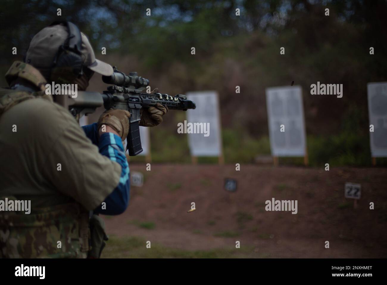 An officer with the Honolulu Police Department fires an M4 service ...