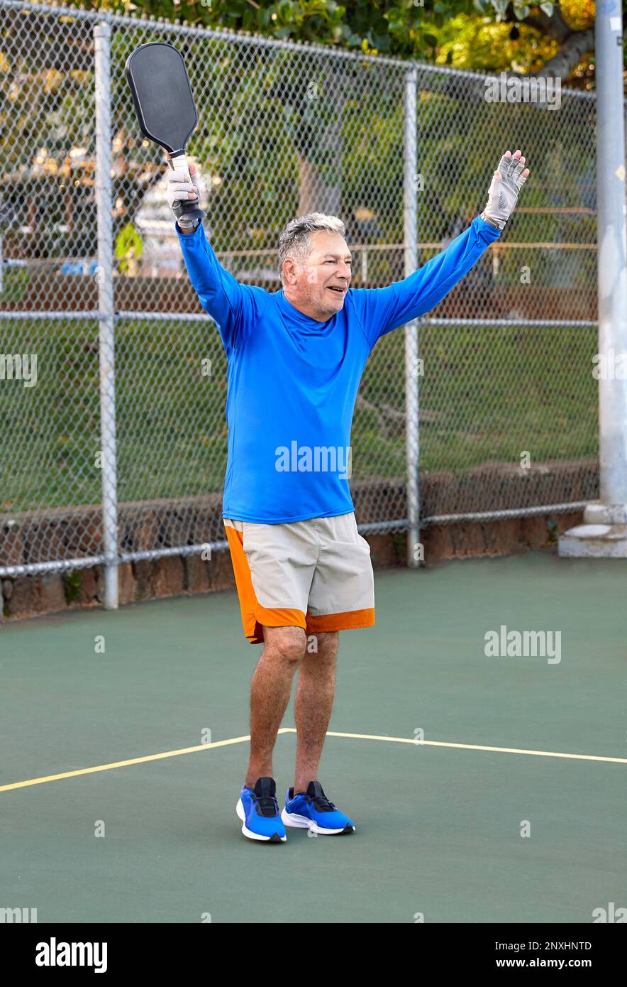 Active Senior Man playing Pickle Ball outdoors Stock Photo - Alamy