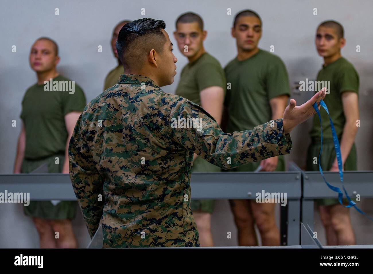 A U.S. Marine gives directions to recruits with Mike Company, 3rd ...
