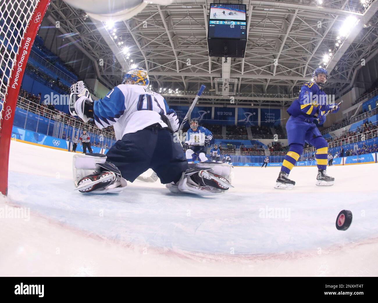 Rebecca Stenberg (23), of Sweden, shoots the puck past goalie Noora ...