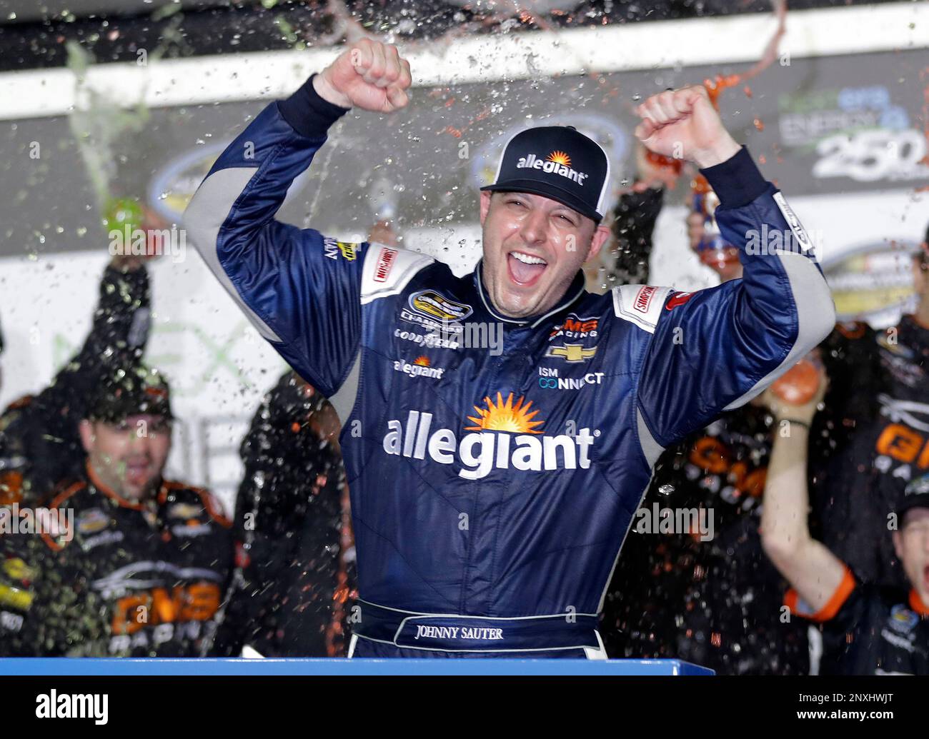Johnny Sauter celebrates in Victory Lane after winning the NASCAR Truck ...