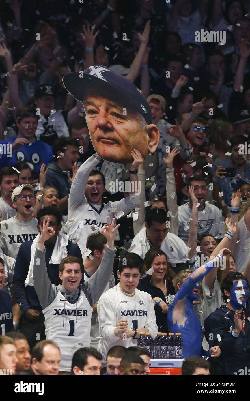 CINCINNATI, OH - FEBRUARY 14: Xavier Musketeers fans cheer and hold up ...