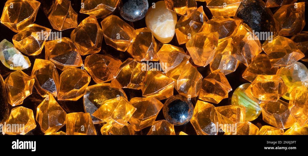 Orange color gem background macro close up view. Amber luxury stone ...