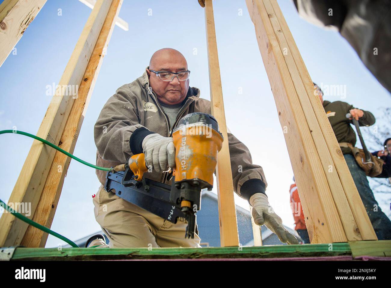 Steve Quiroz helps Volunteers, and Habitat for Humanity workers as they ...