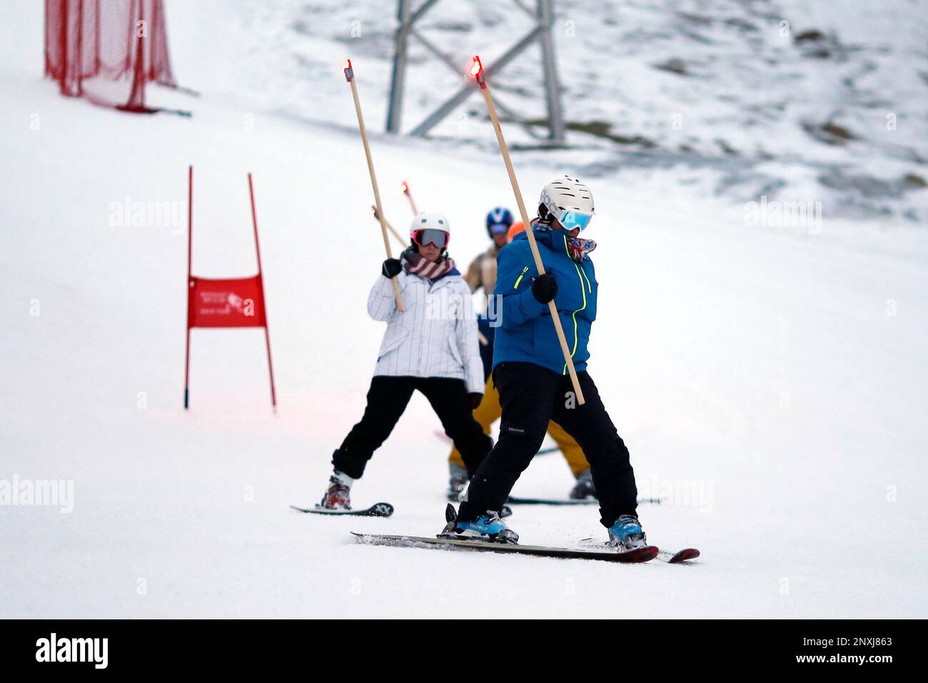 As former teammates of Navy Lt. Steven Combs ski through the gates in ...