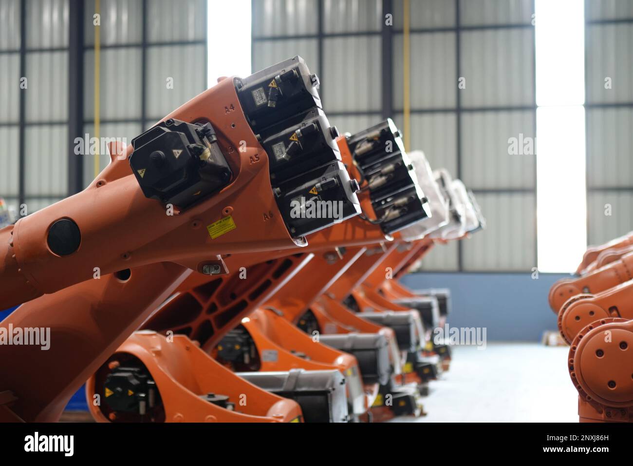 Robotic arm in futuristic assembly manufacturing factory, in factory ...