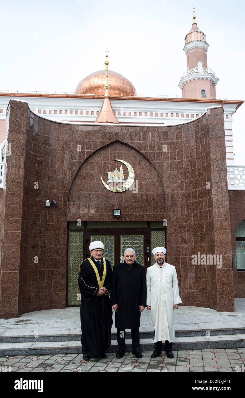 Turkey's Prime Minister Binali Yildirim, center, Turkey's Religious ...