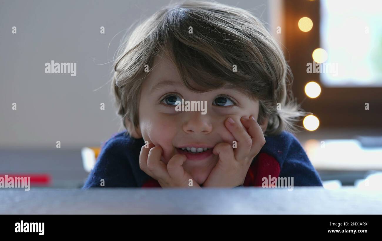 One handsome 2 year old child posing for camera. Closeup face of a cute ...