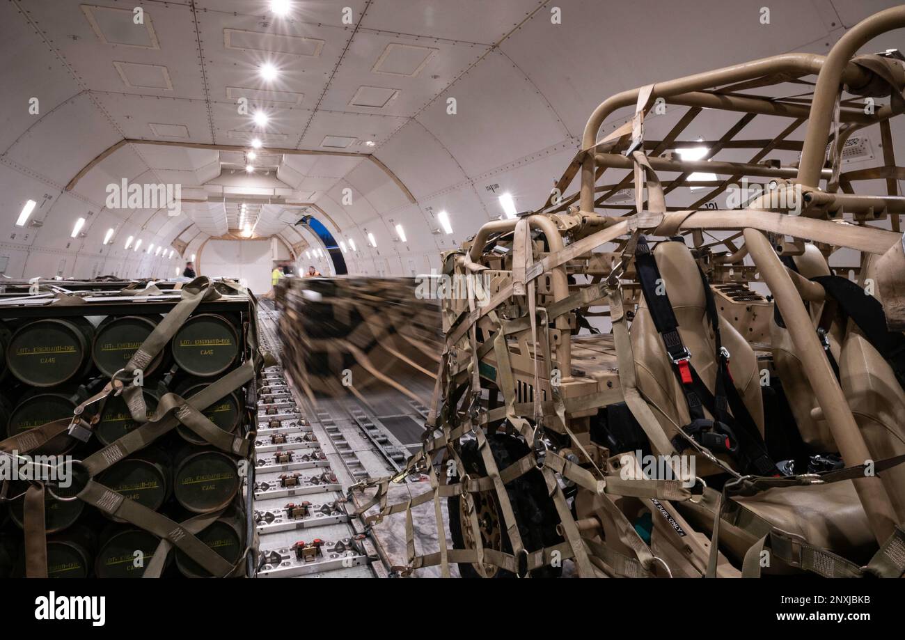 Tactical vehicles and pallets of ammunition, bound for Ukraine, are ...