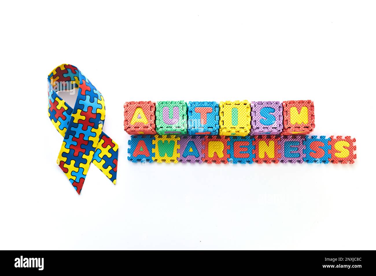 Autism word colorful puzzle hi-res stock photography and images - Alamy