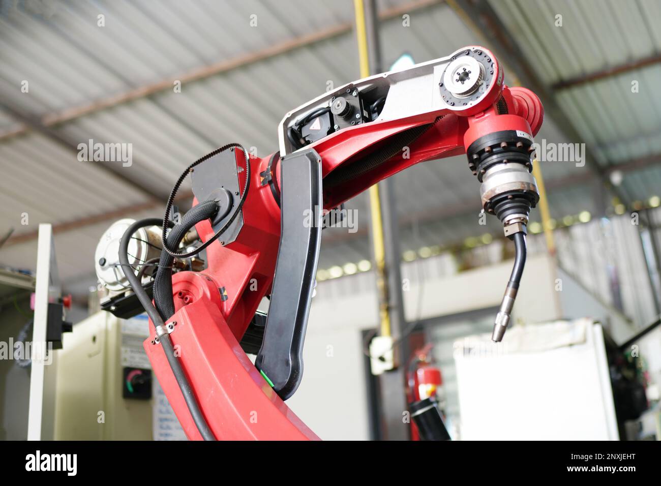 Robotic arm in futuristic assembly manufacturing factory, in factory ...