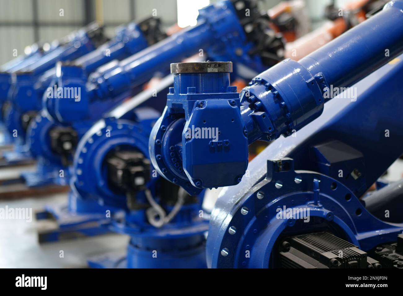 Robotic arm in futuristic assembly manufacturing factory, in factory ...