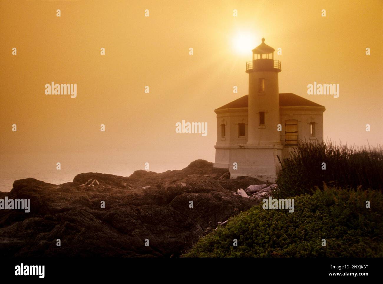 The Coquille River Lighthouse near Bandon, Oregon faces the elements at ...