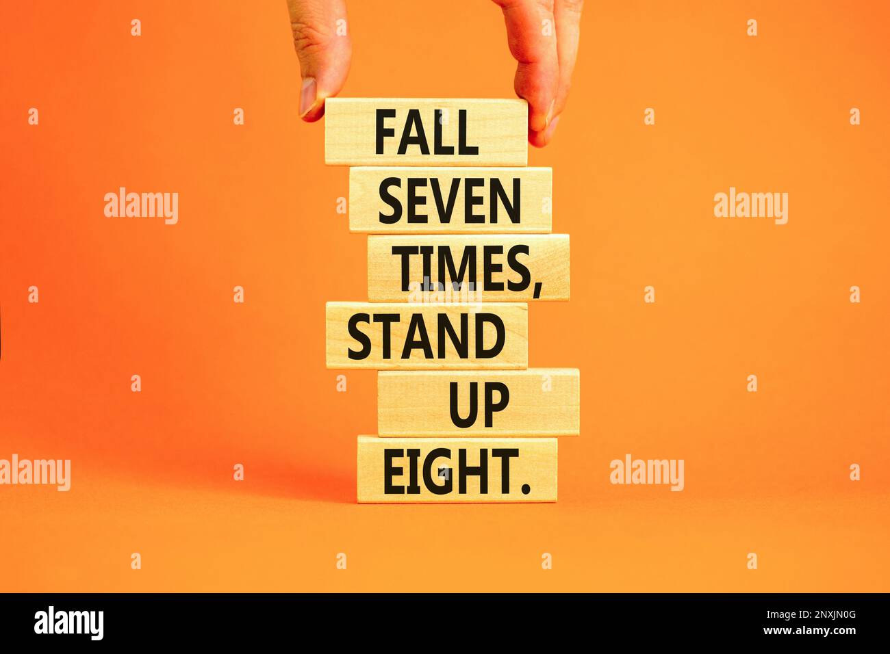 Stand up symbol. Concept words Fall seven times stand up eight on ...