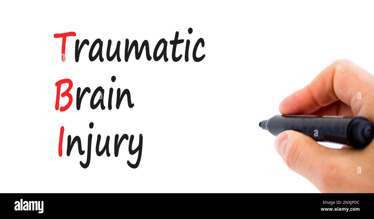 TBI traumatic brain injury symbol. Concept words TBI traumatic brain injury on paper on a ...