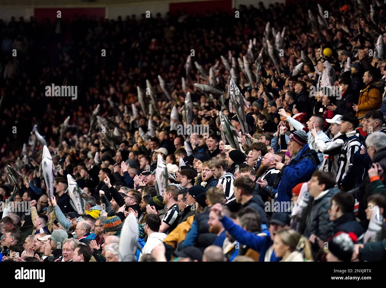 Grimsby Town fans hold up inflatable fish in the stands during the ...