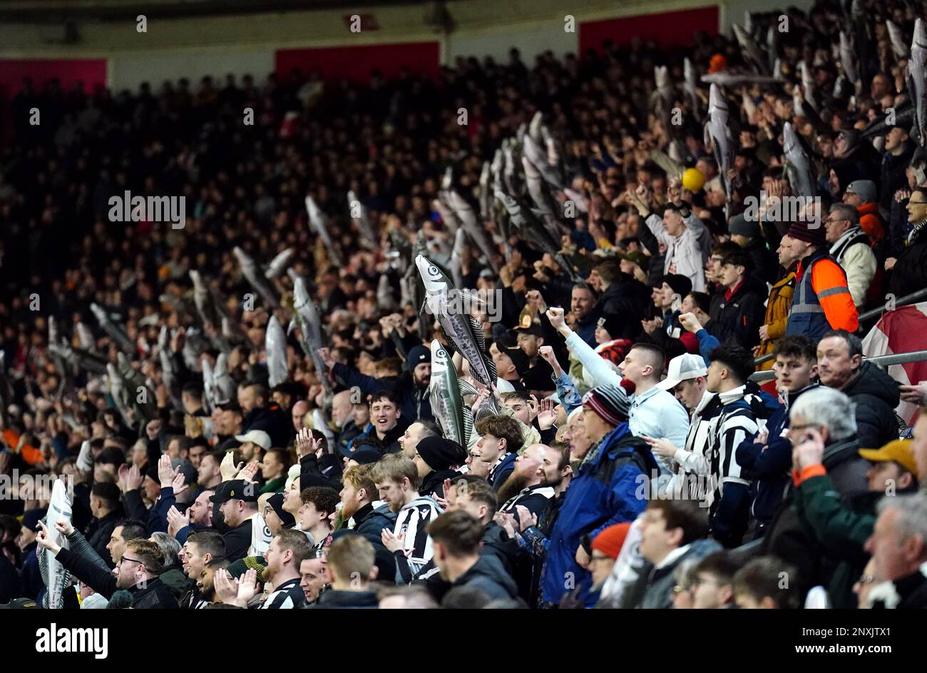 Grimsby Town fans hold up inflatable fish in the stands during the ...