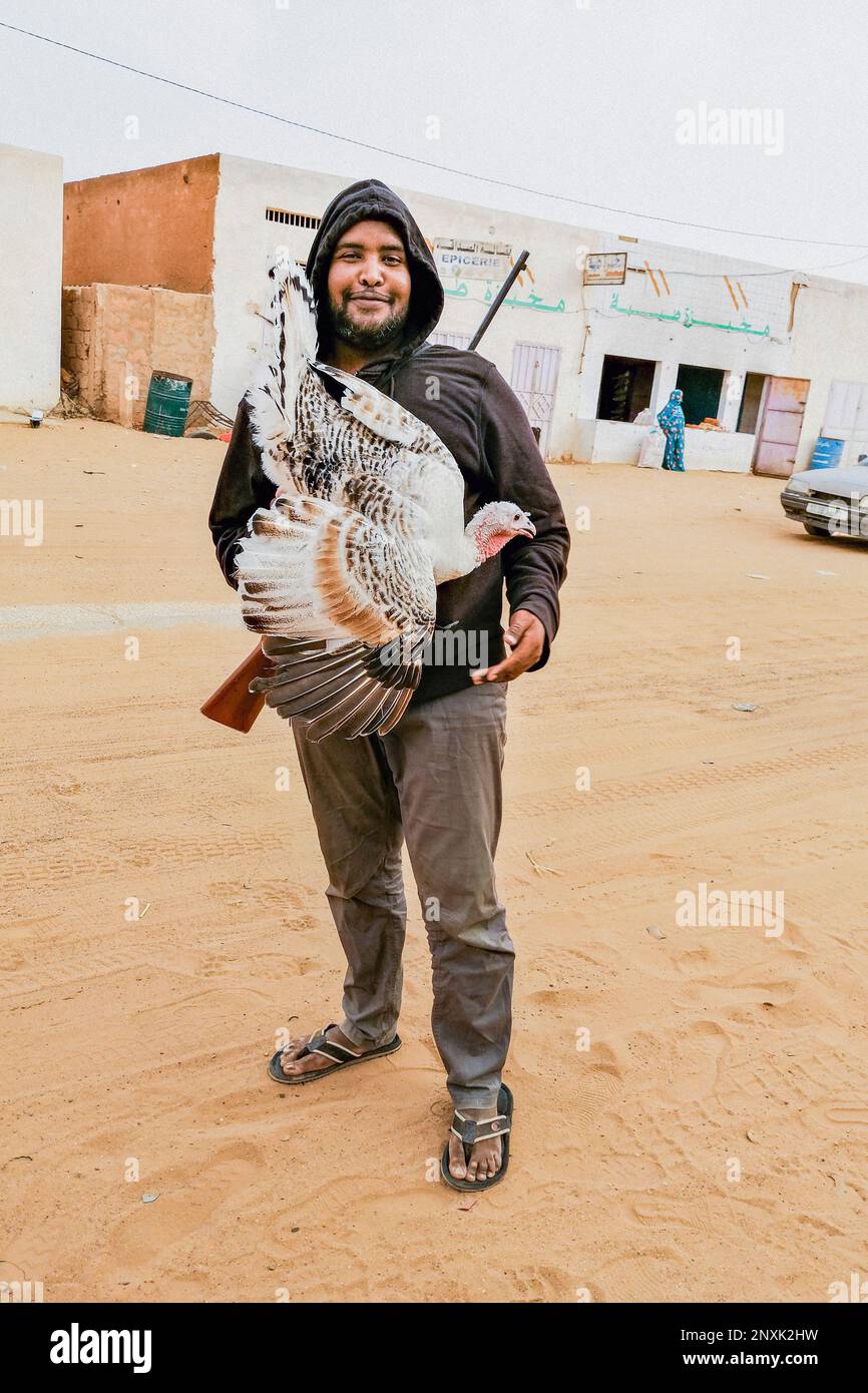 Mauritania, Aleg, man and turkey Stock Photo - Alamy