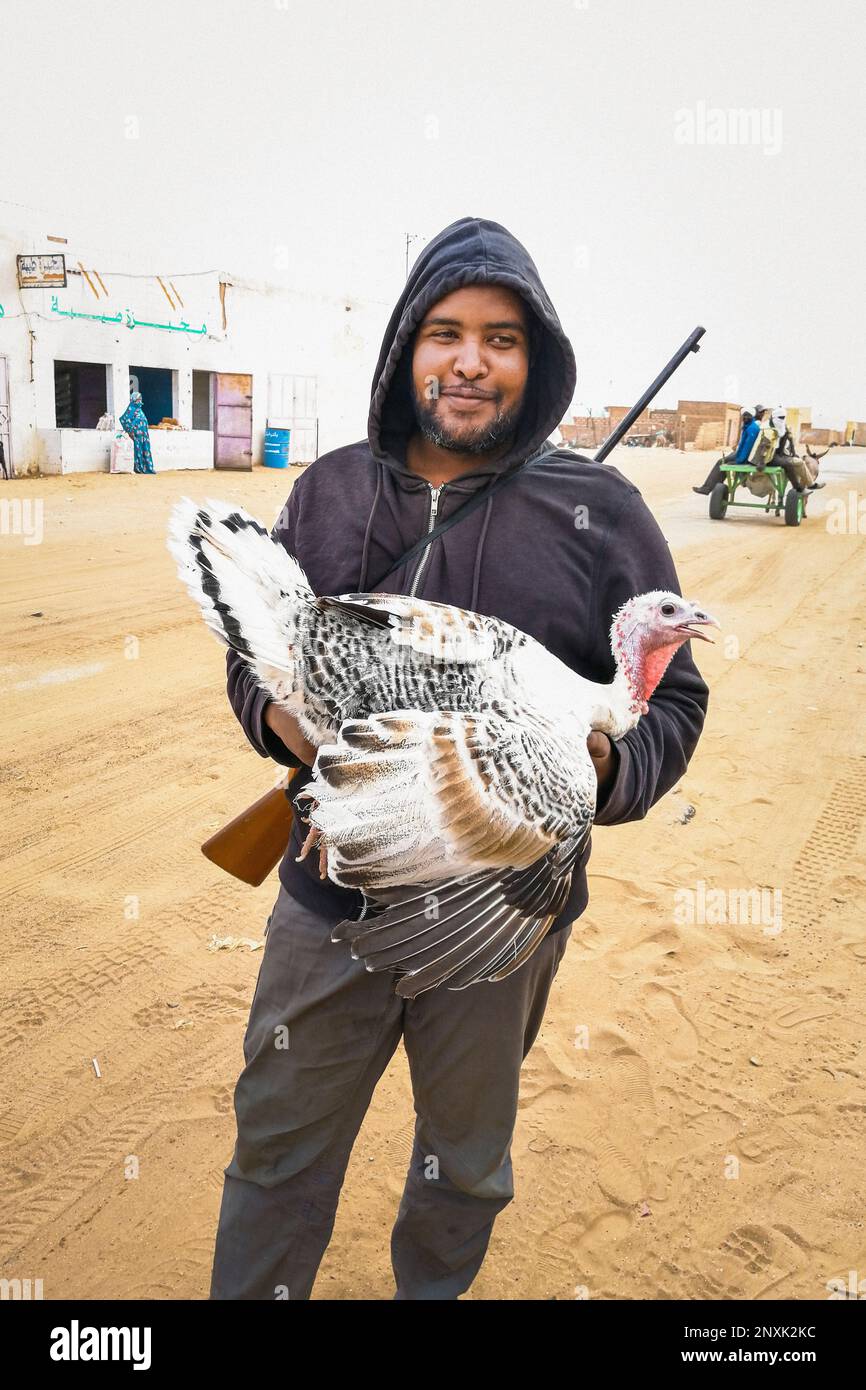 Mauritania, Aleg, man and turkey Stock Photo - Alamy