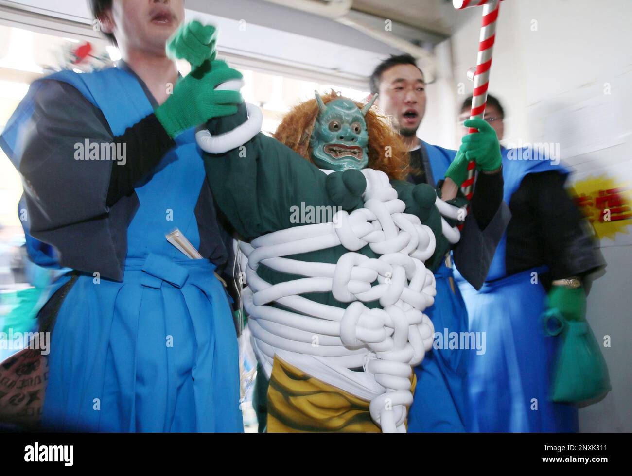 A blue ogre walks throughout the town as the "Ogre Festival" starts at ...