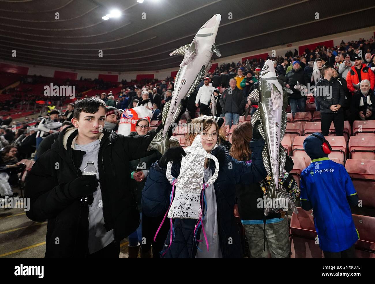 Grimsby Town fans hold up inflatable fish in the stands during the ...