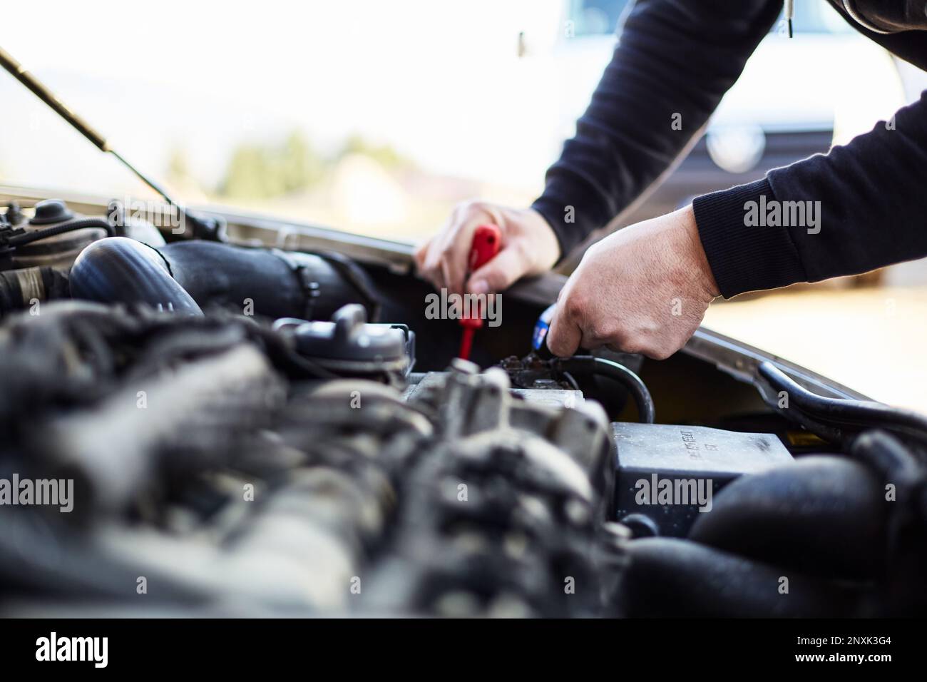 Men hands checking car engine Stock Photo - Alamy