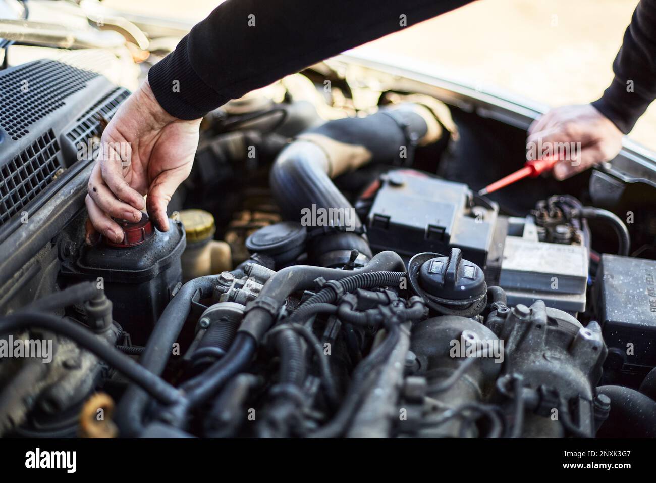 Men hands checking car engine Stock Photo - Alamy