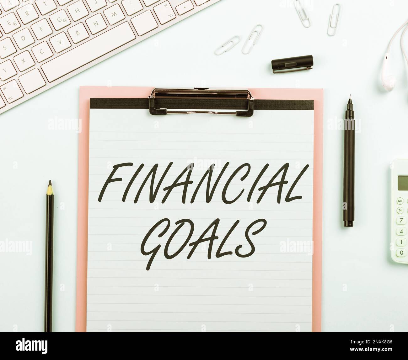 Hand writing sign Financial Goals. Concept meaning targets usually ...