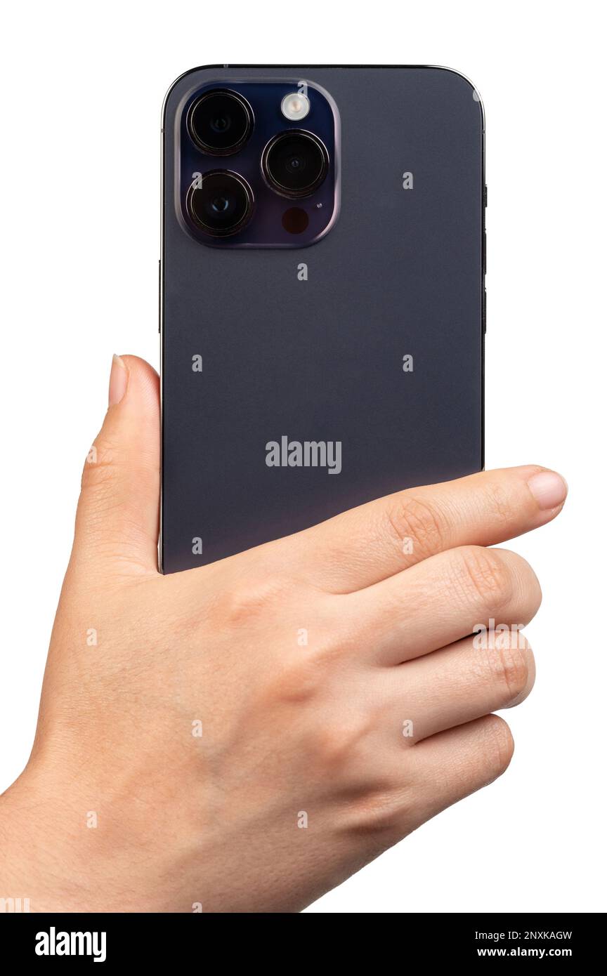 Hand hold purple smartphone with triple camera set isolated on white ...