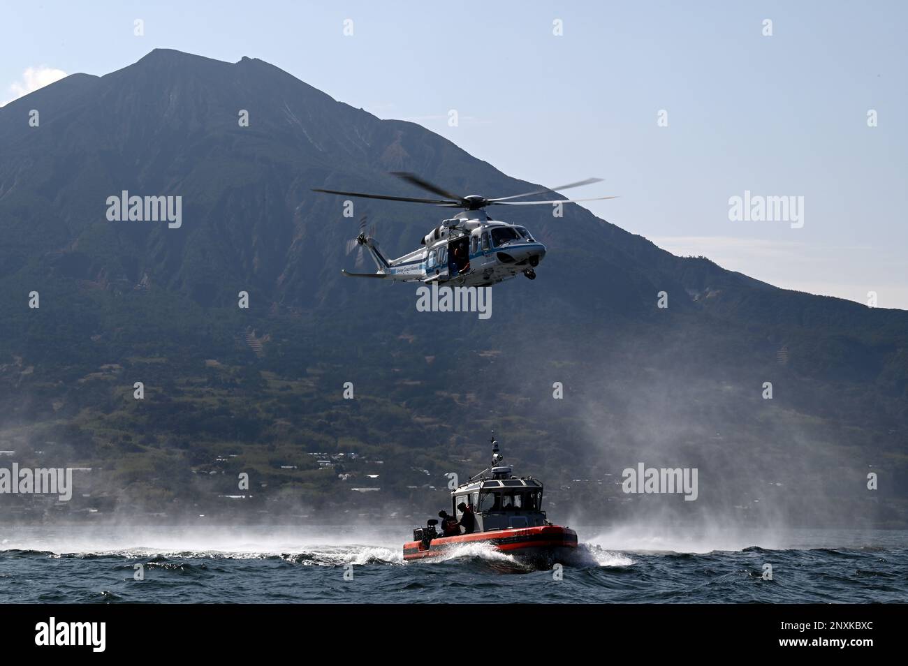 A Japan Coast Guard AgustaWestland AW139 helicopter aircrew prepares to ...