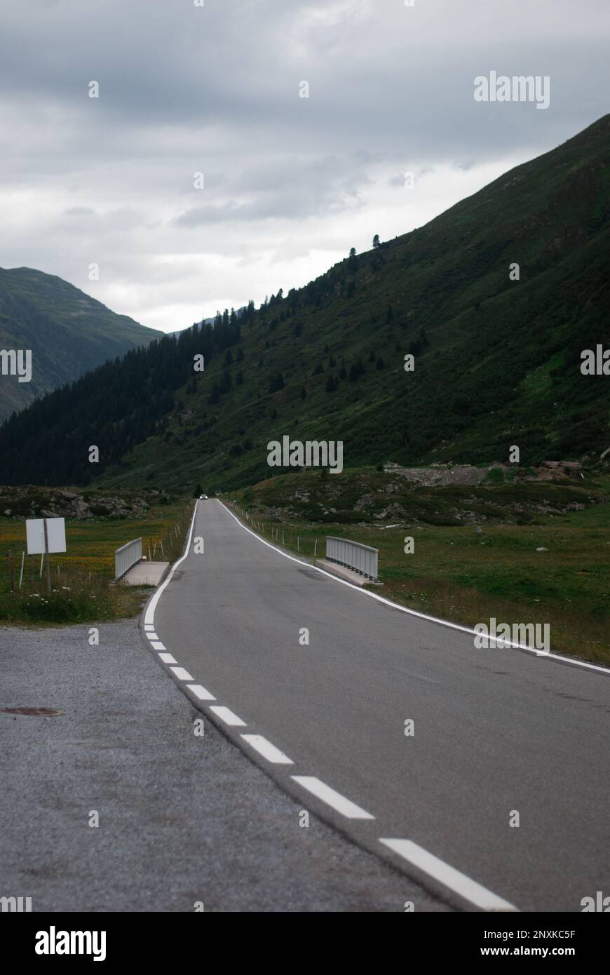 Road in mountains in Alps Stock Photo - Alamy