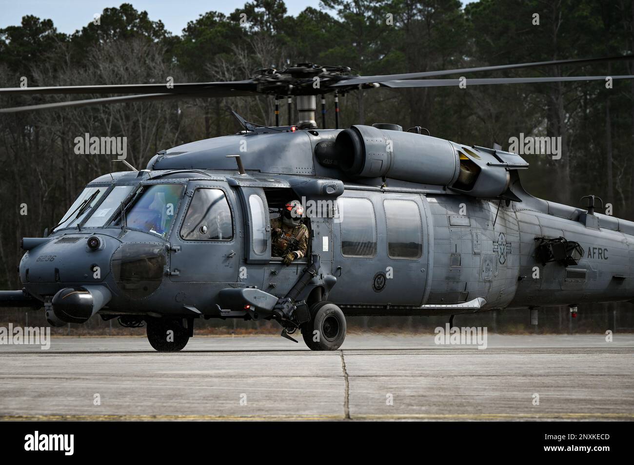 A U.S. Air Force HH-60G Pave Hawk crew member from the 920th Rescue ...