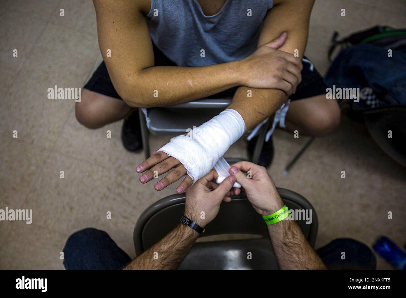 Jared George's hands are wrapped for his fight at the Infamous MMA ...