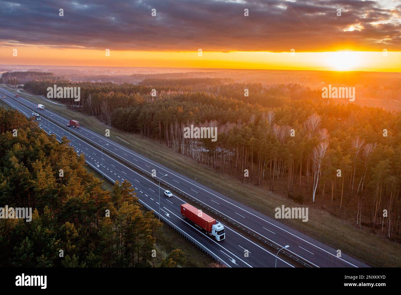 Trucks drive along the A1 Amber One Highway near Gajewo village in ...