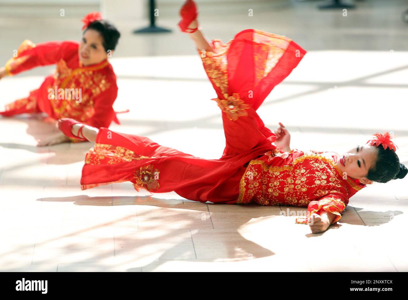 Sarah Xuejiao Zhang, foreground, and her teacher Yali Fan perform ...