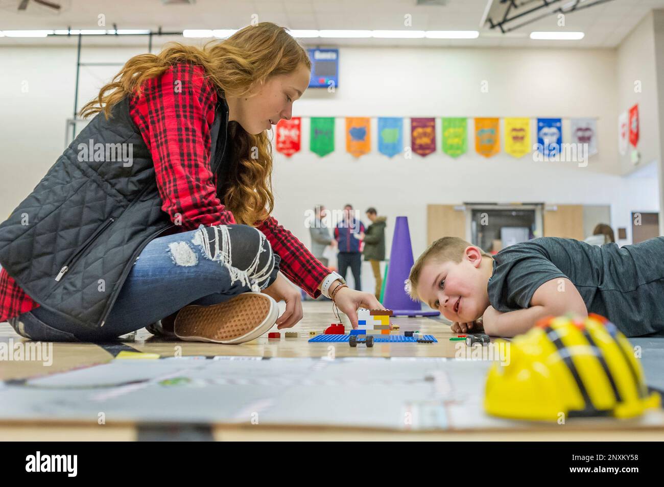 Big King Kaylin Silcox, 17, and her Little King Dillon Lee, 8, work on ...