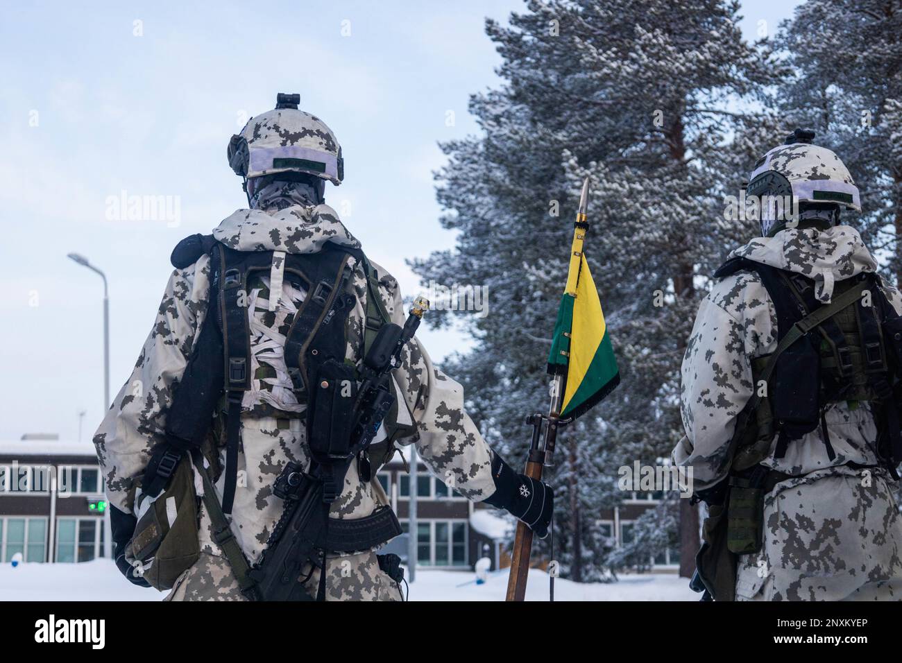 A Finnish soldier from the Jaeger Brigade carries the brigade flag on ...