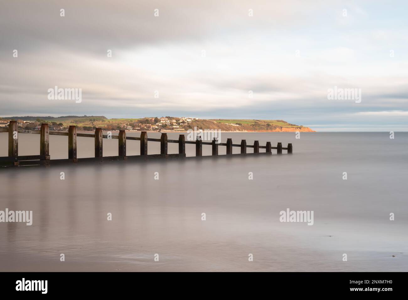 Landscape photo of a groyne in the sea at Dawlish Warren nature reserve ...