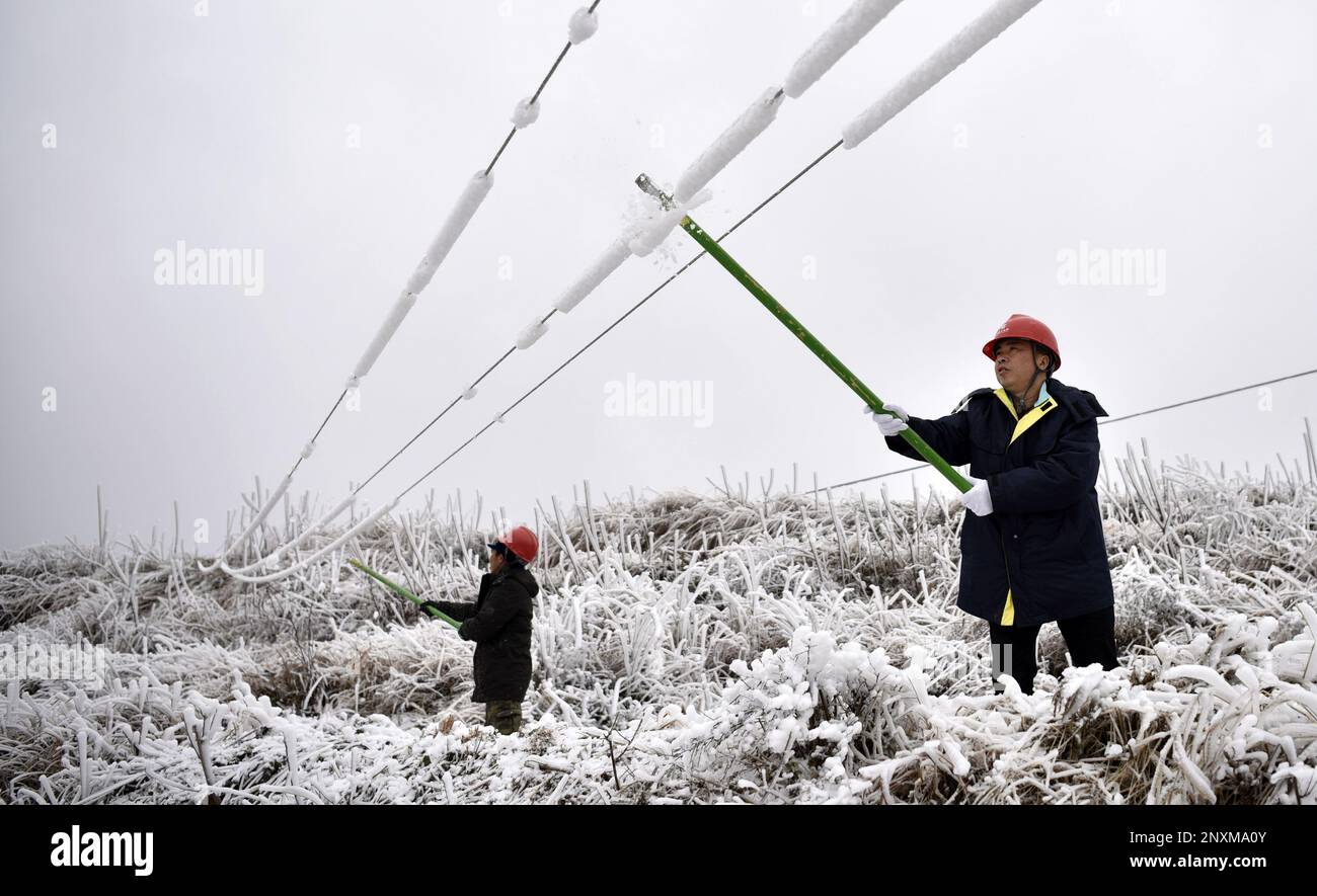 The workers are repairing the power lines which were damaged by ...