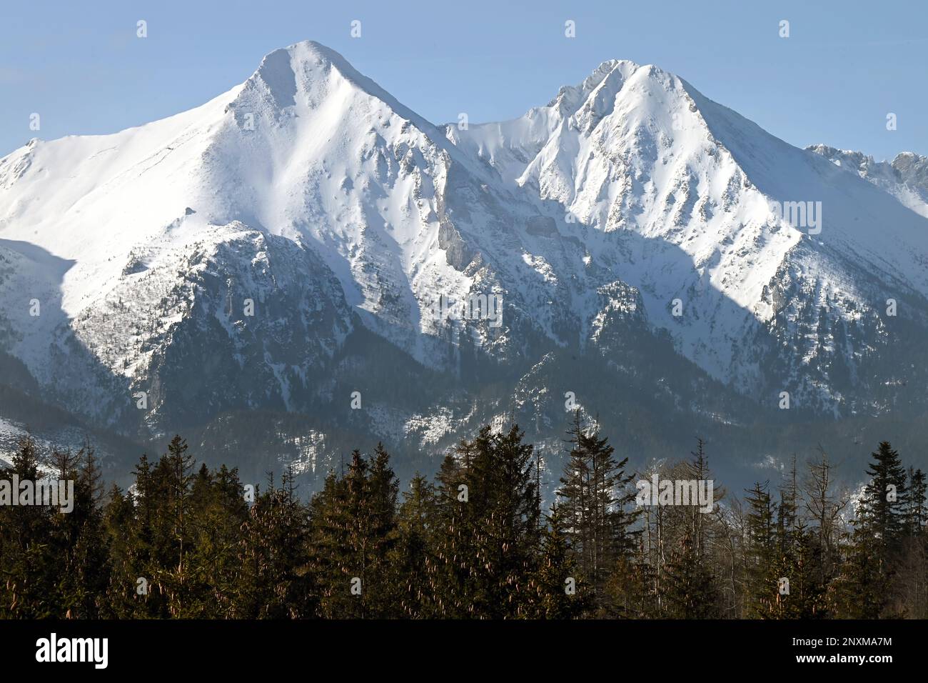 Scenic view of Belianske Tatry mountain range covered in snow, with ...