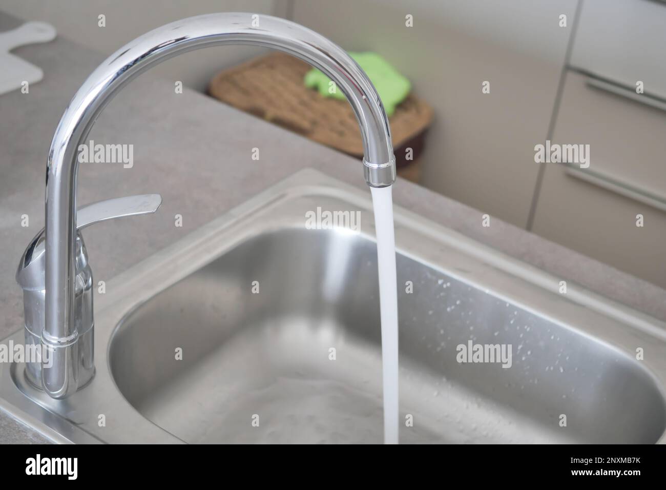 water pouring from a faucet tap slow motion Stock Photo - Alamy