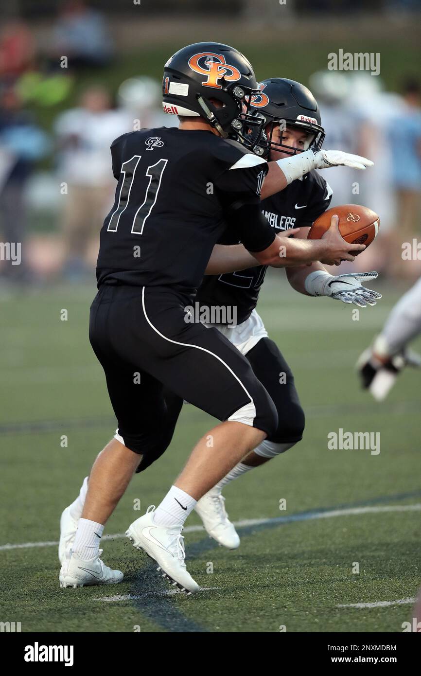 Erie Cathedral Prep Ramblers quarterback Joseph Mischler (11) hands off ...
