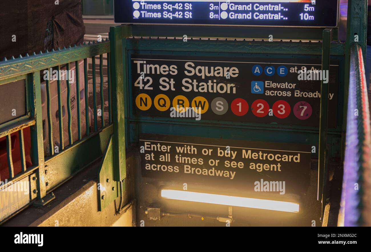 Close up view of subway name information board at entrance to station ...