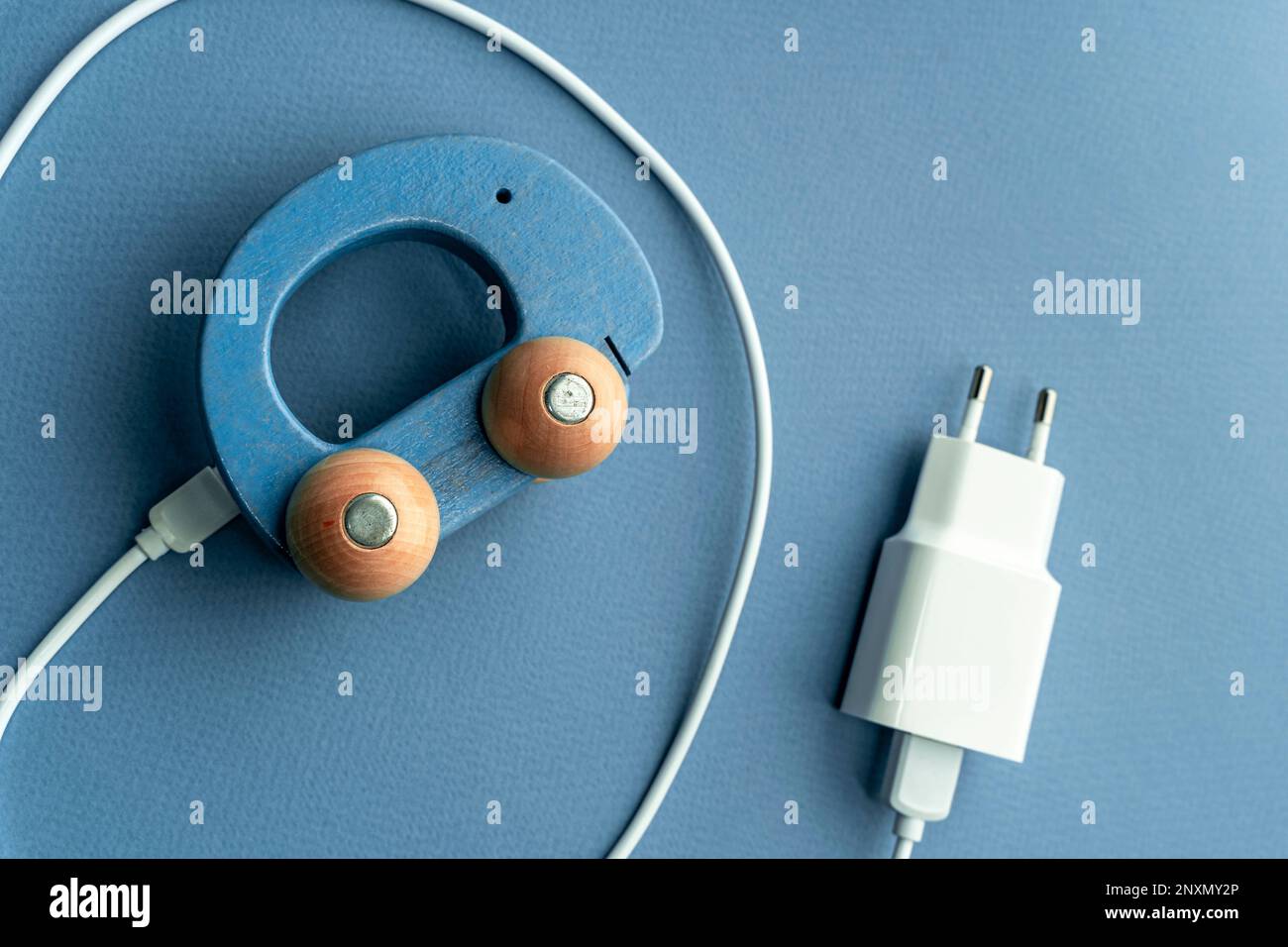 phone charger is connected to a children's car on a blue background ...