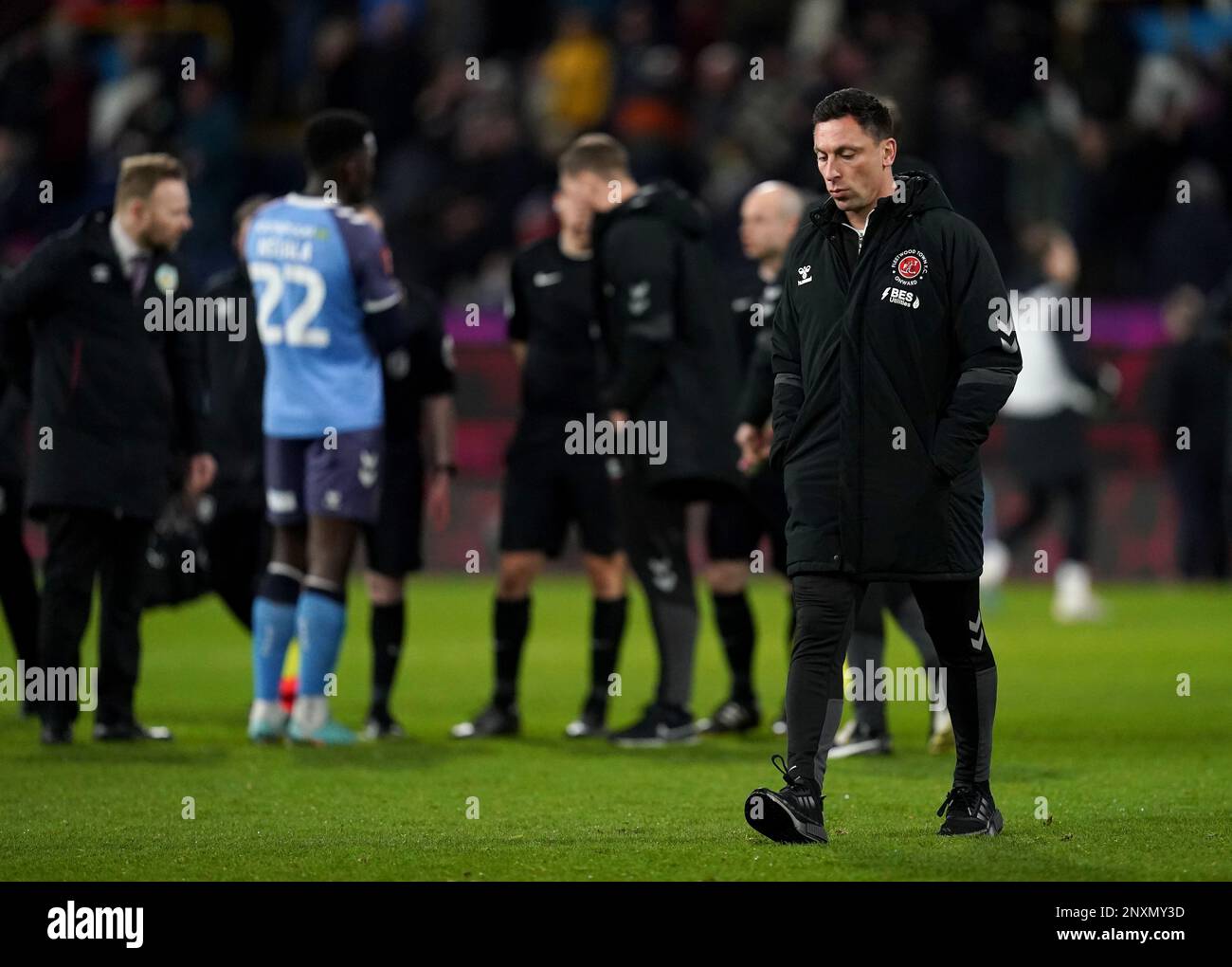 Fleetwood Town manager Scott Brown leaves the field as players and ...