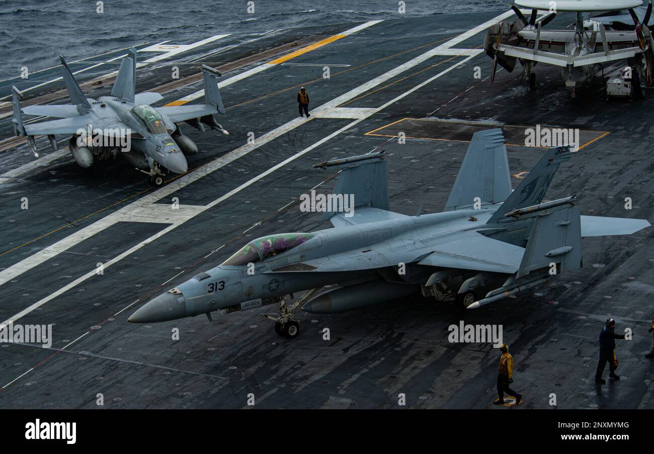 230130-N-MH015-1060 SOUTH CHINA SEA (Jan. 30, 2023) An F/A-18F Super Hornet from the “Mighty ...