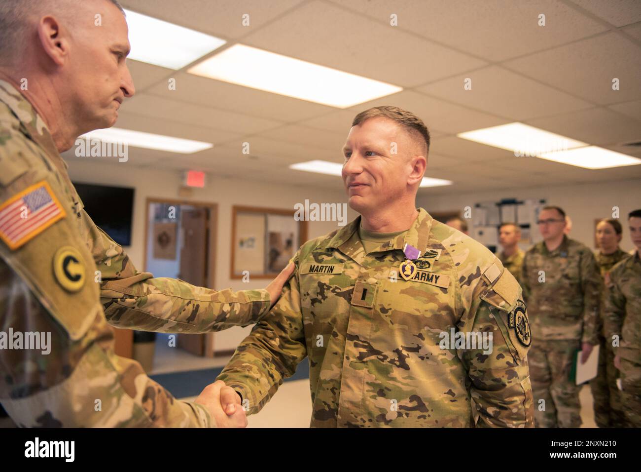 1st Lt. Bret Martin is awarded the Purple Heart for wounds received on ...