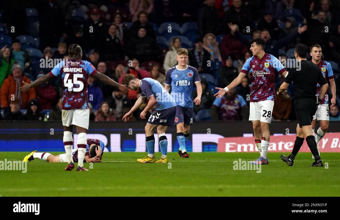 Burnley's Josh Cullen looks in pain before Fleetwood Town's Cian Hayes ...