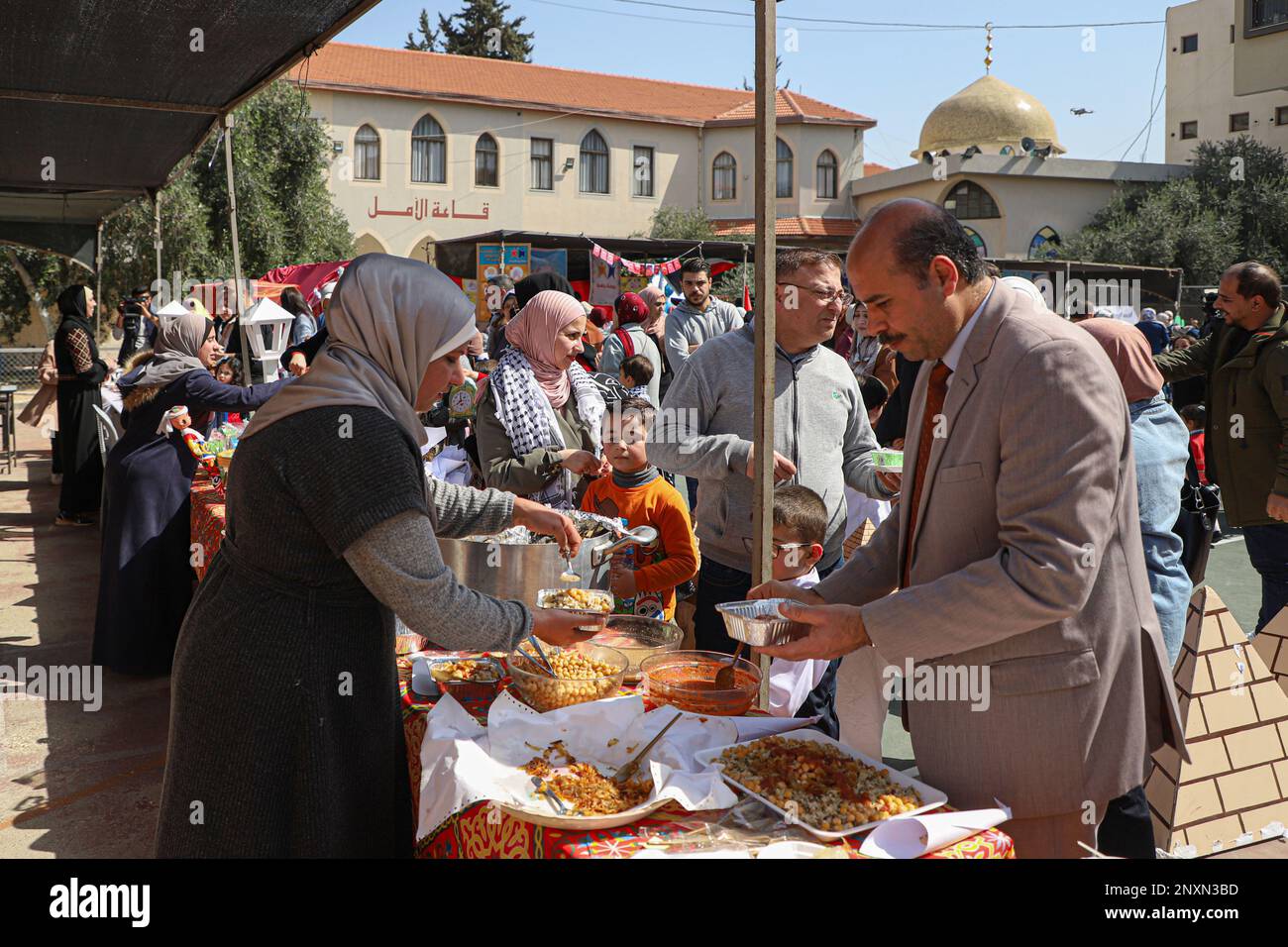 Gaza. 1st Mar, 2023. People visit a bazaar showing customs and ...