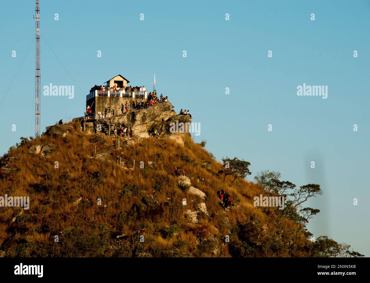 mountain peak with people in chapel at sunset - pico dos pireneus ...